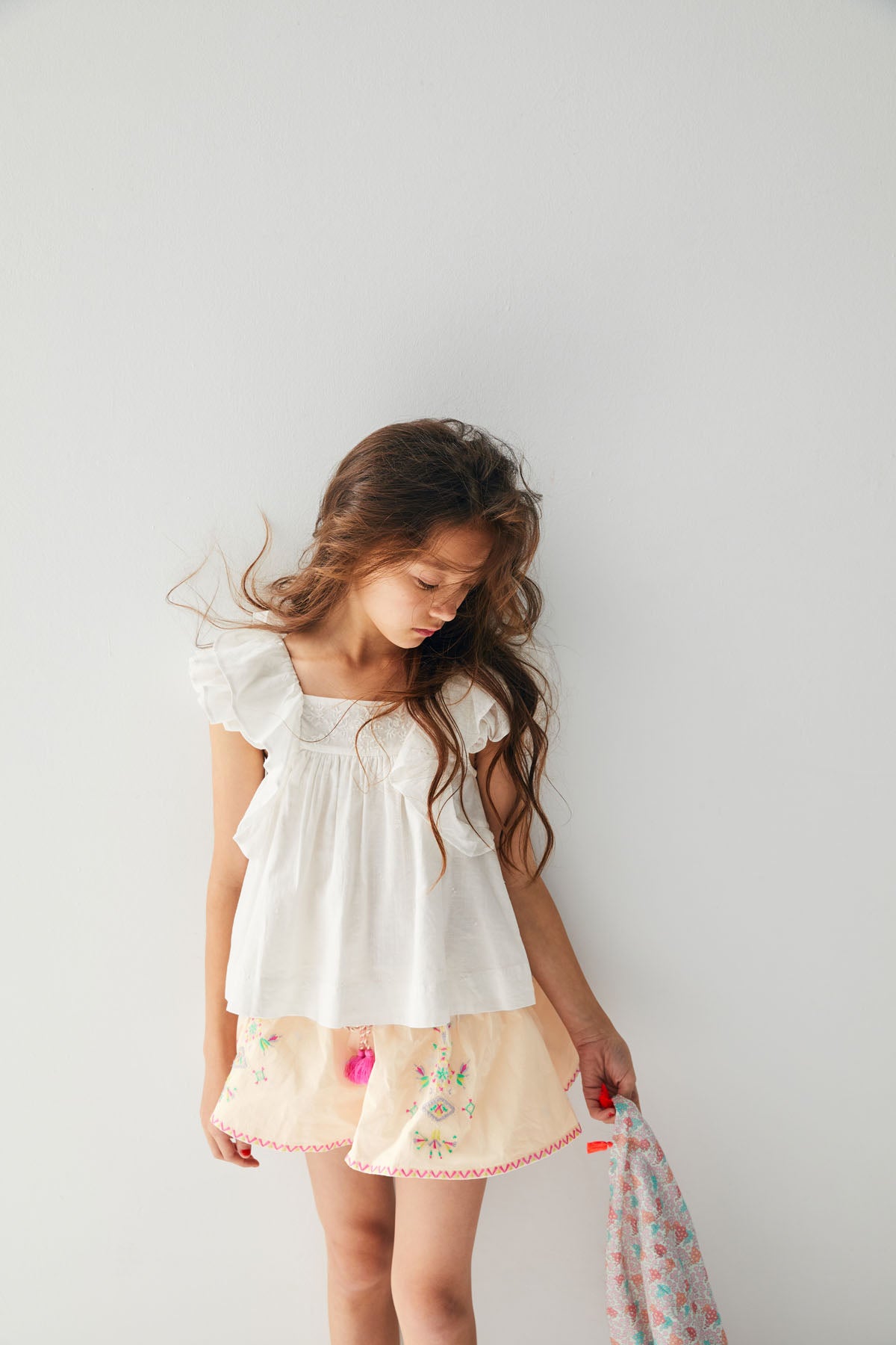 Poppy Shorts | Cream linen flared shorts with pompoms – NELLYSTELLA